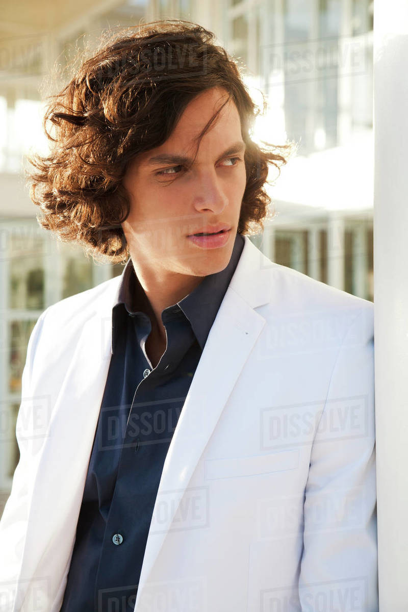 Man looking over his shoulder - Royalty-free Stock Photo | Dissolve