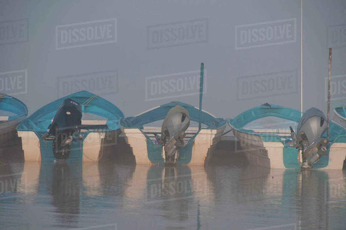 Mexico, Baja California Sur, Puerto Lopez Mateos, morning fog and boats ...