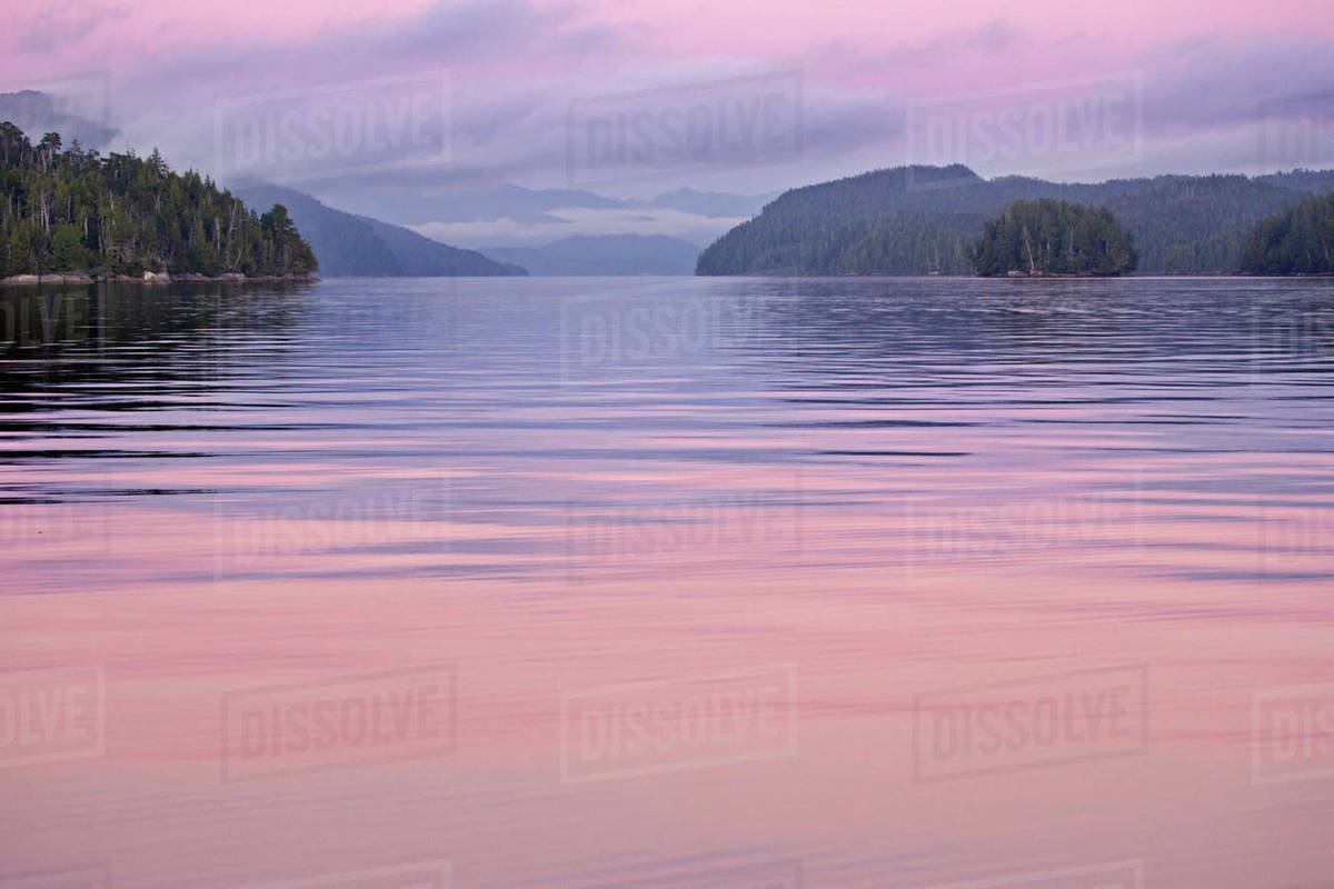 Panoramic view of the sea with a mountain range in the background ...