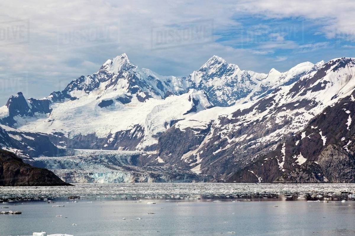Lake with snowcapped mountain range in the background, Tarr Inlet, John ...