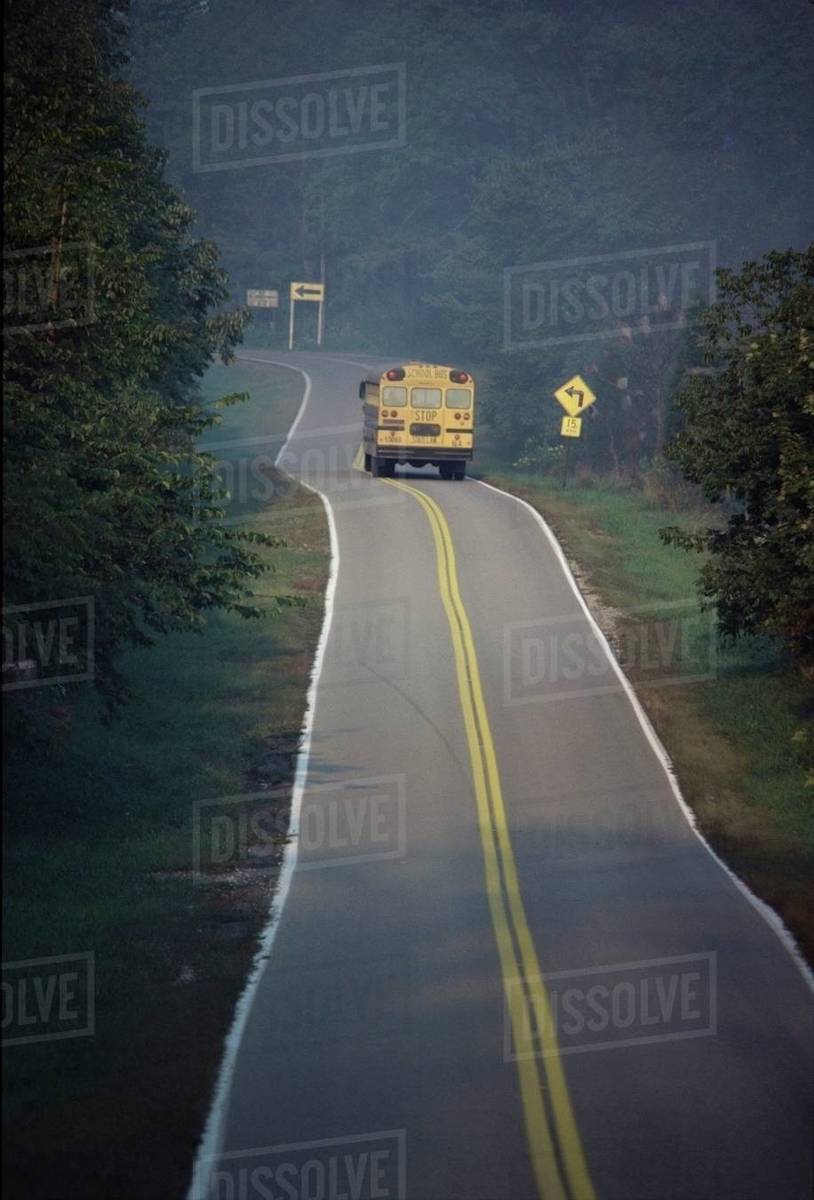 School bus on the road - Royalty-free Stock Photo | Dissolve