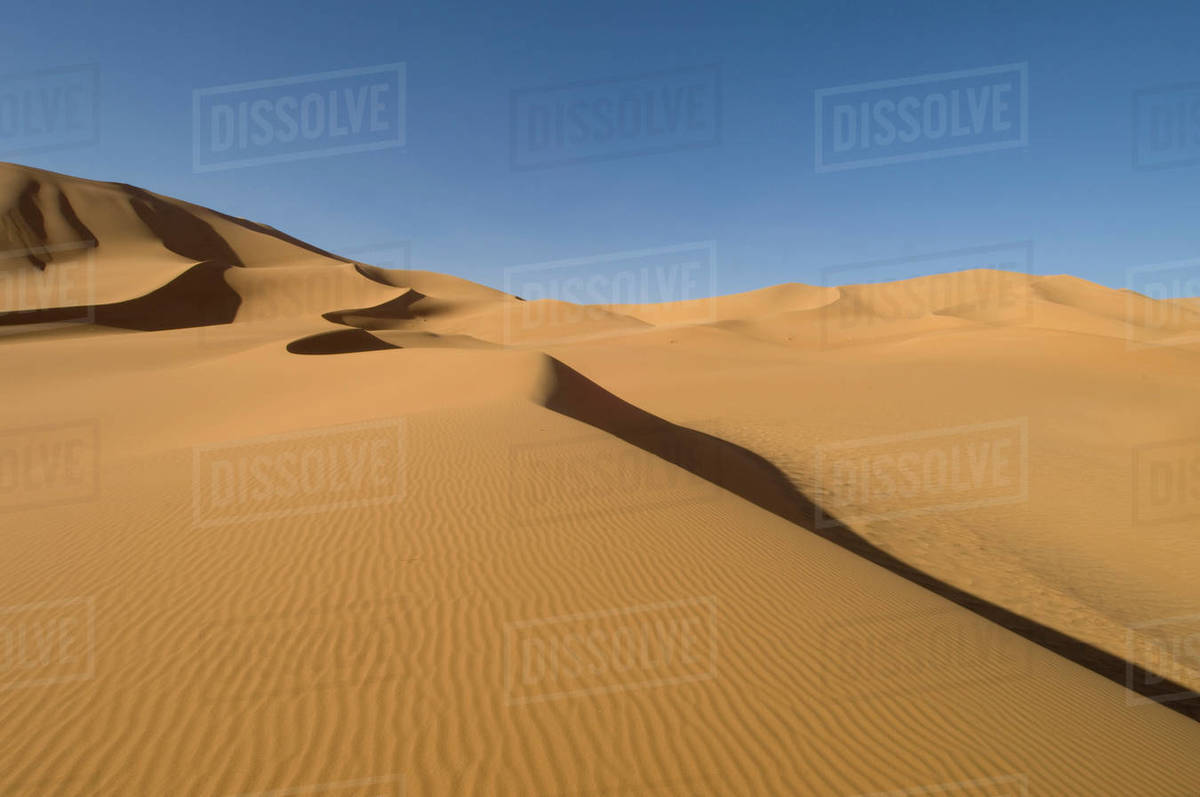 Sand dunes in a desert, Erg Awbari, Fezzan, Libya - Royalty-free Stock ...