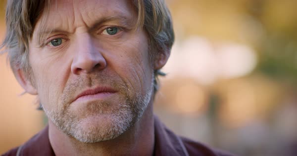 Man looking into camera with a troubled expression - 4K Royalty-free ...