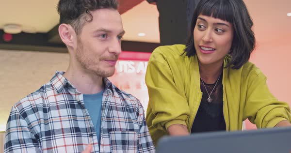 Two people talking to each other at a desk - 4K Royalty-free Stock ...
