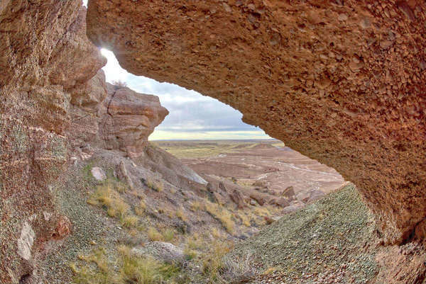 A shallow cave in the western cliff of the Blue Mesa at Petrified ...