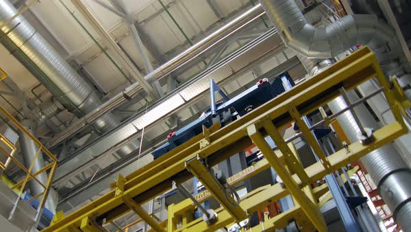 Huge equipment for moving car bodies and details in a workshops of auto ...