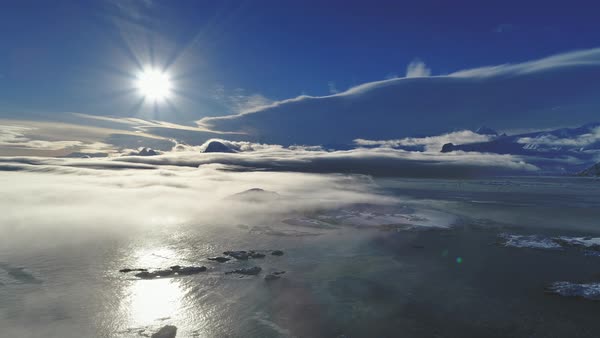 Antarctica landscape. Aerial view drone flight. Sun track of white ...