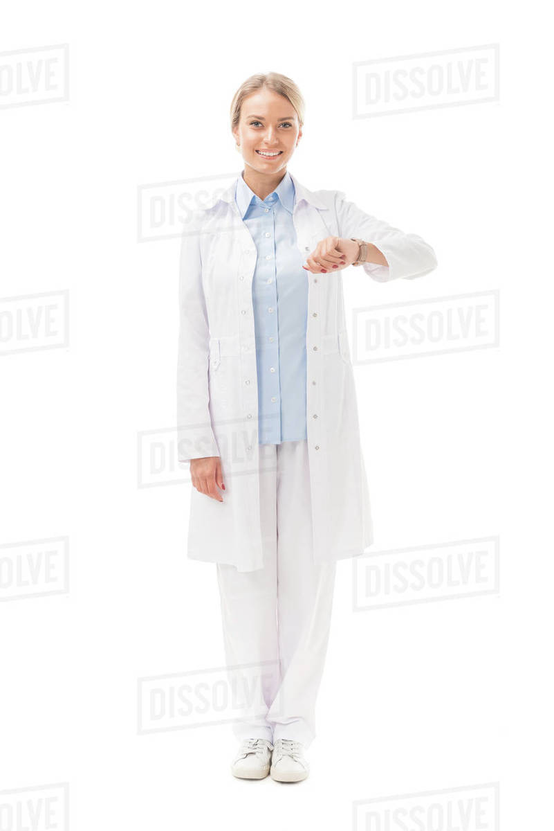 beautiful young female doctor with wrist watch looking at camera ...