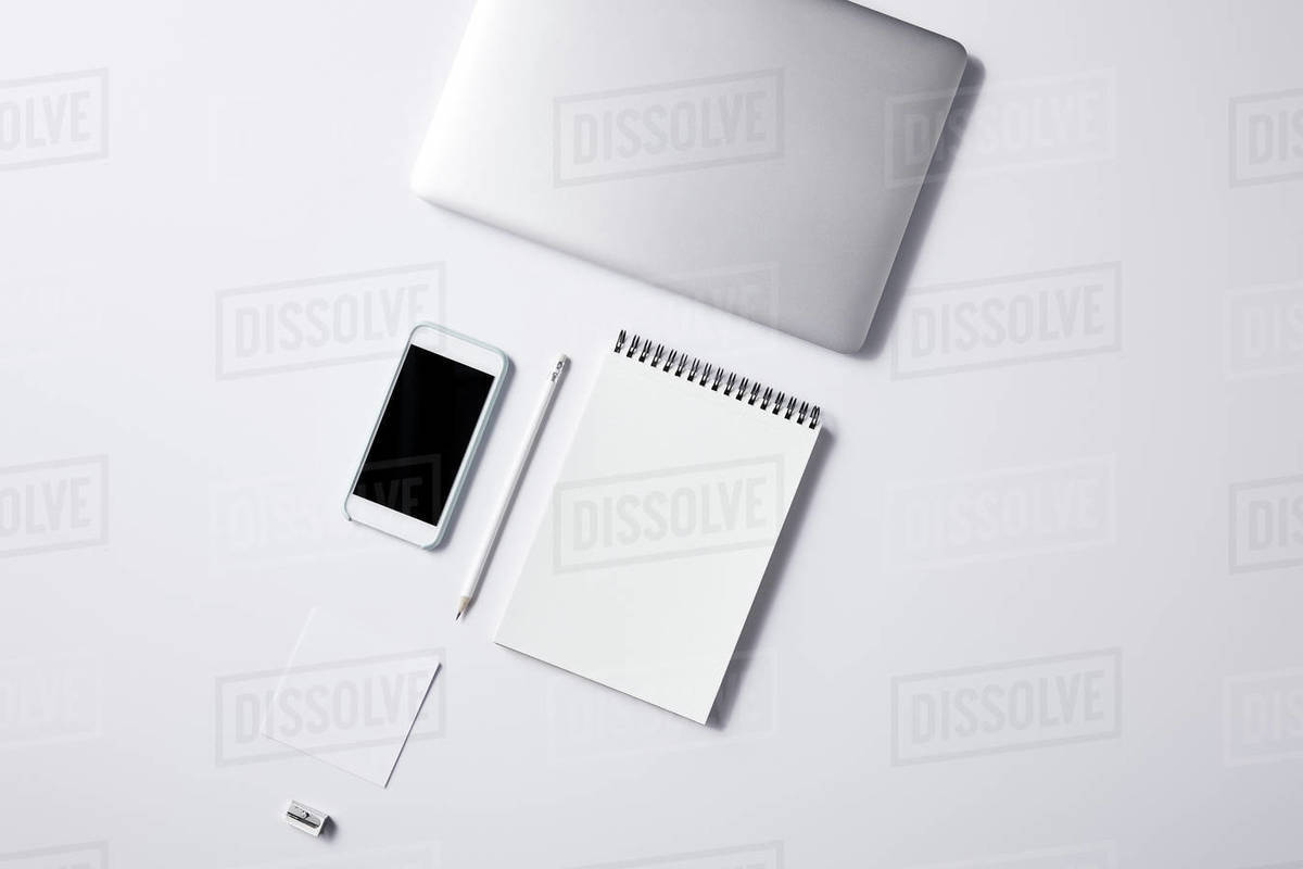 Top view of arranged various business workplace objects on white ...