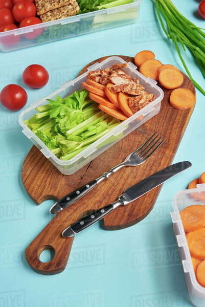 close up view of cutlery and healthy food composition on blue ...