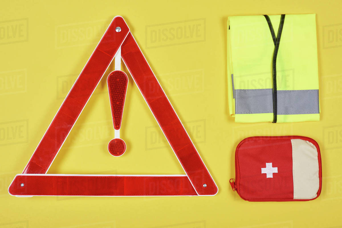 top view of warning triangle road sign, first aid kit and reflective ...