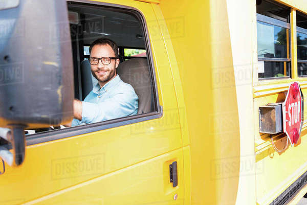 attractive happy school bus driver looking at camera - Stock Photo ...
