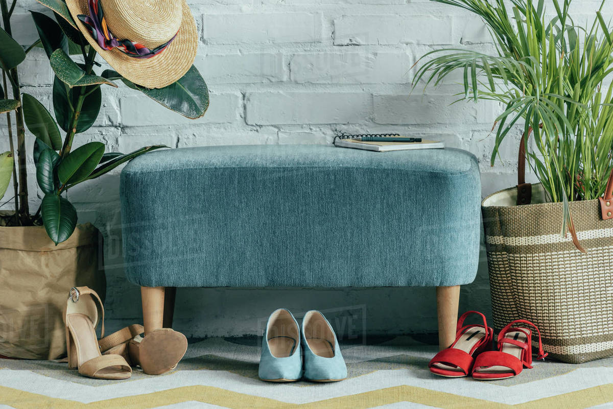 Different shoes under chair in corridor at home - Royalty-free Stock ...
