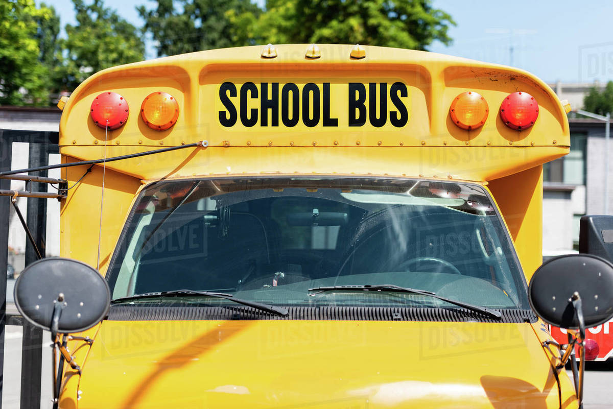 front view of school bus with inscription over front glass - Stock ...