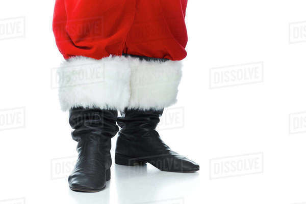 cropped view of santa claus posing in boots isolated on white - Royalty ...