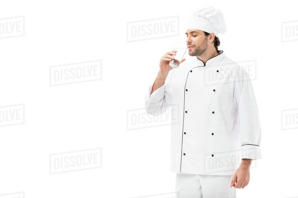 Handsome young chef drinking water isolated on white - Stock Photo ...