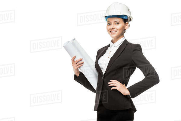 Beautiful young female architect in helmet and suit holding blueprints ...