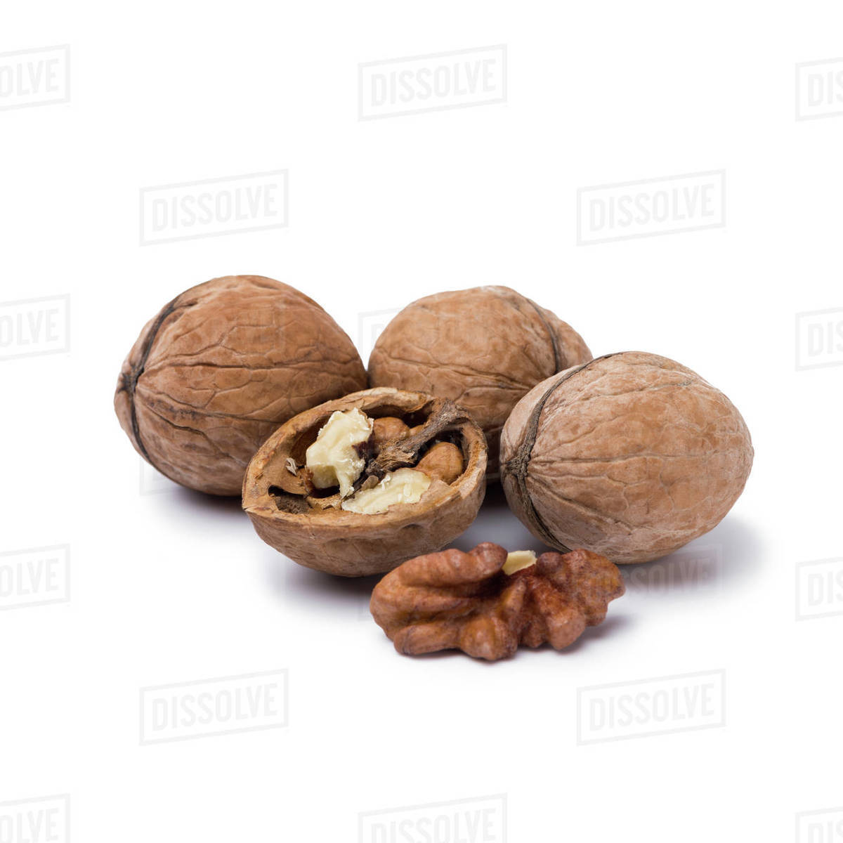 Handful of walnuts isolated on white background - Stock Photo - Dissolve