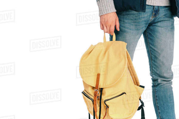 cropped shot of young traveler holding backpack isolated on white ...