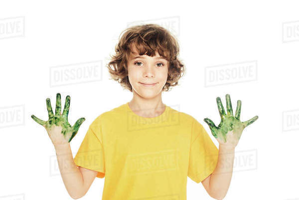 Adorable happy little boy with hands in colorful paint smiling at ...