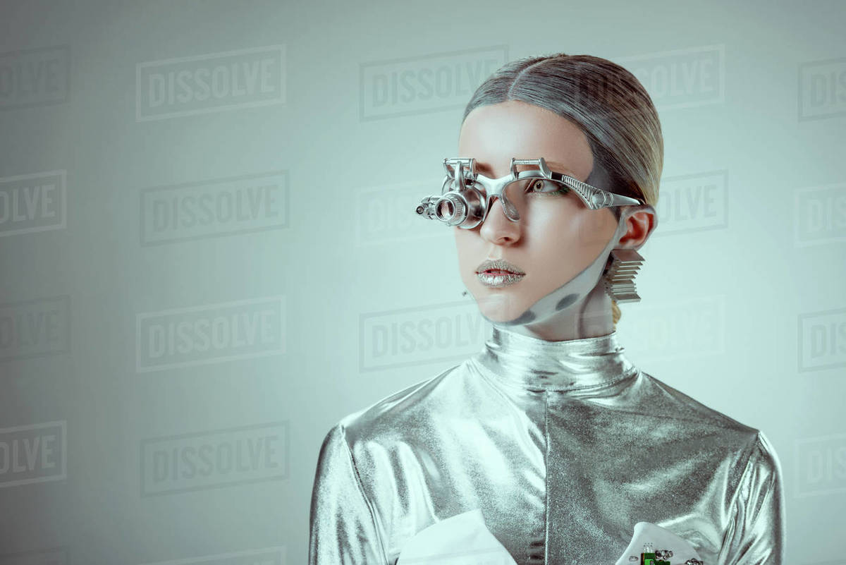 Futuristic silver robot looking away isolated on grey, future ...