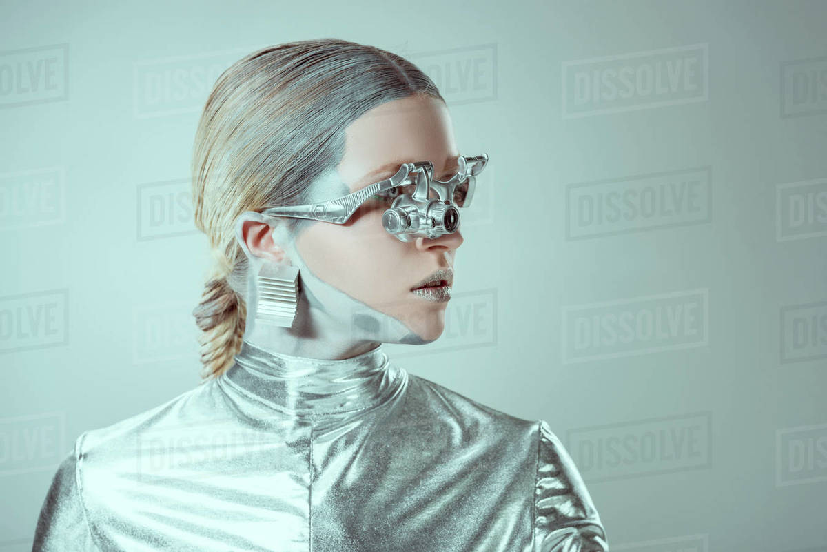 Futuristic silver cyborg looking away isolated on grey, future ...