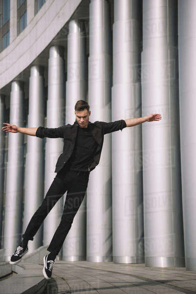 Young contemporary dancer jumping in dance on street - Royalty-free ...