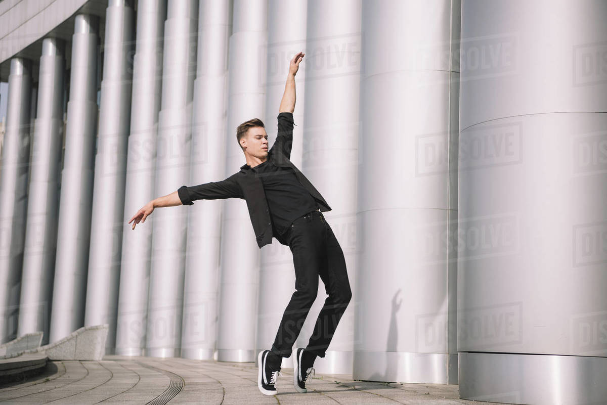 Handsome young modern dancer dancing near columns - Royalty-free Stock ...