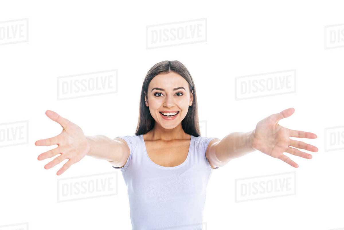 Portrait of happy young woman with outstretched arms isolated on white ...