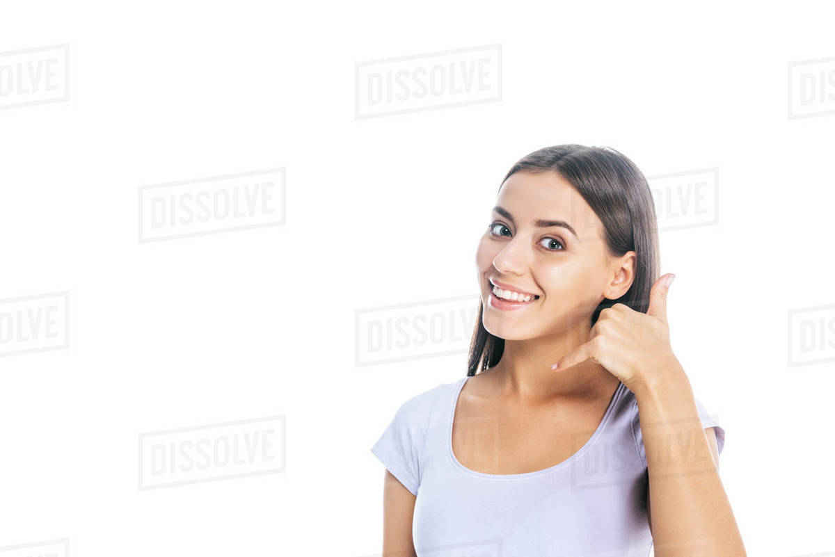 Portrait of smiling woman showing call sign isolated on white - Royalty ...