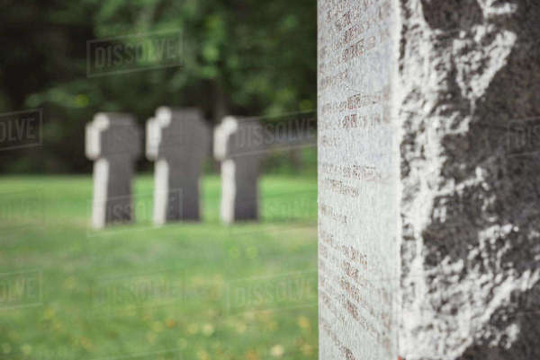 selective focus of old stone tomb with lettering at cemetery - Royalty ...