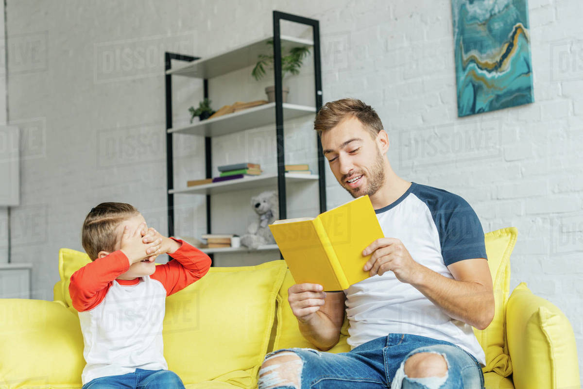Father reading book for little son at home - Royalty-free Stock Photo ...