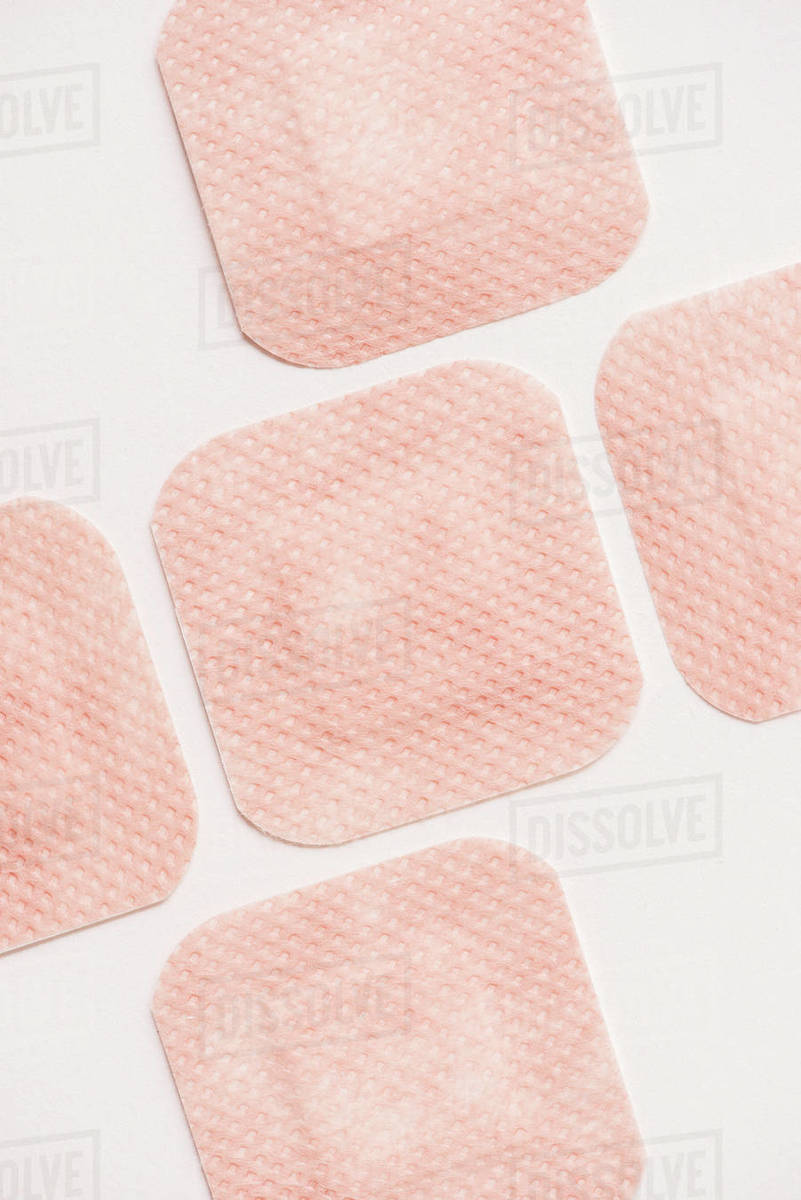 Top view of adhesive bandages on white surface - Royalty-free Stock ...