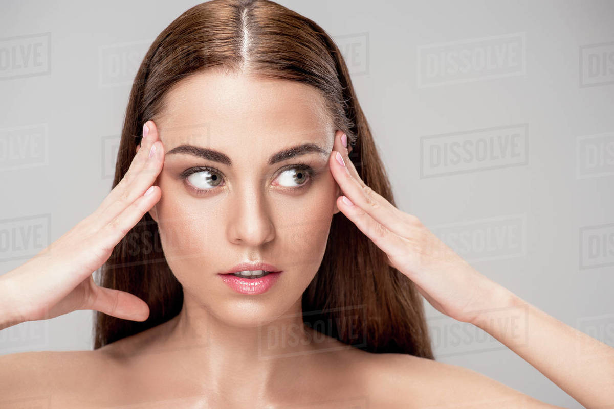 Portrait of brunette thoughtful woman with clean face, isolated on grey ...
