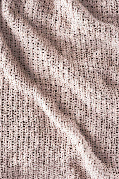 Full frame of wavy knitted cloth as background - Stock Photo - Dissolve