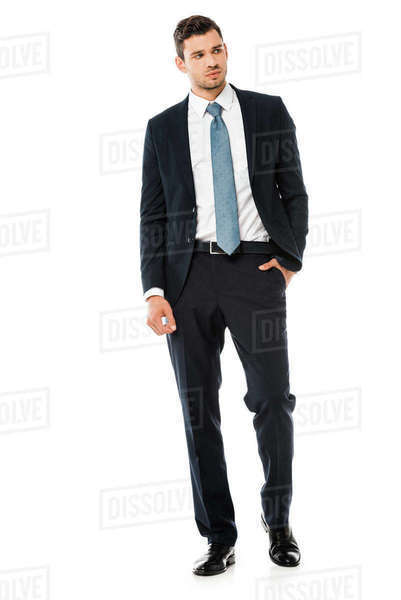serious handsome businessman in suit standing isolated on white ...