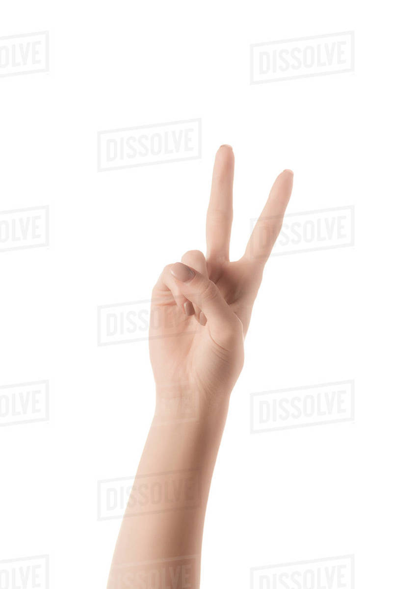 Partial view of woman showing number 2 in sign language isolated on ...