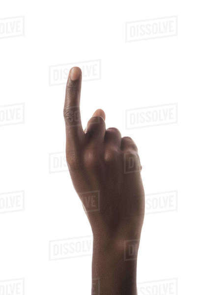 Cropped view of African American man showing number 1 in sign language ...