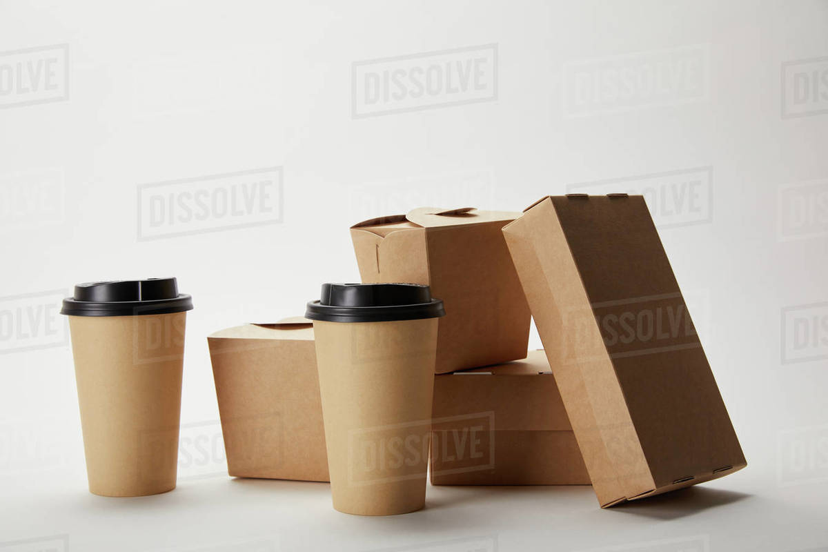 Disposable coffee cups and cardboard food boxes on white - Royalty-free ...