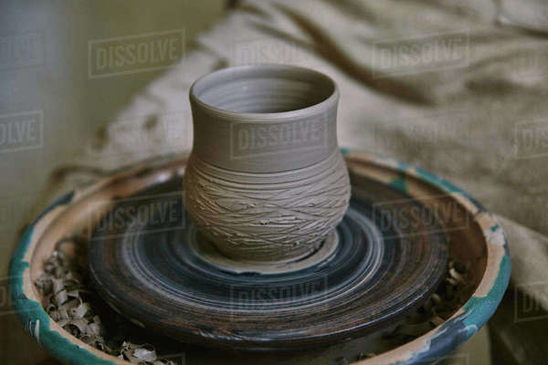 selective focus of clay pot on pottery wheel at workshop - Royalty-free ...