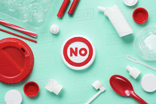 Top view of no sign and disposable plastic wares on blue background ...