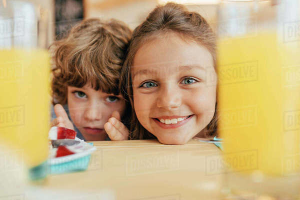 portrait of funny little kids looking at camera - Stock Photo - Dissolve