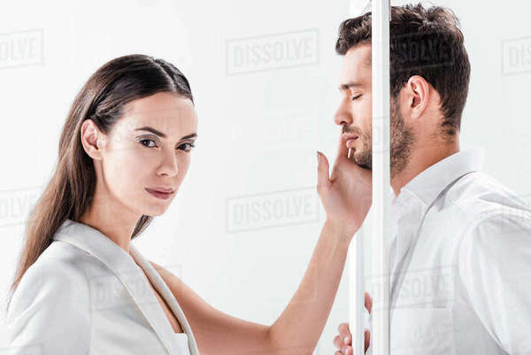 close up of beautiful woman touching man with frame isolated on white ...