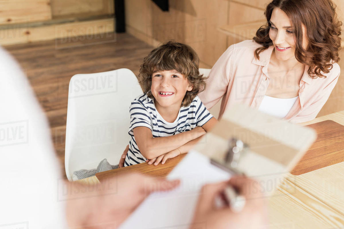 Happy mother and son making order in cafe - Royalty-free Stock Photo ...