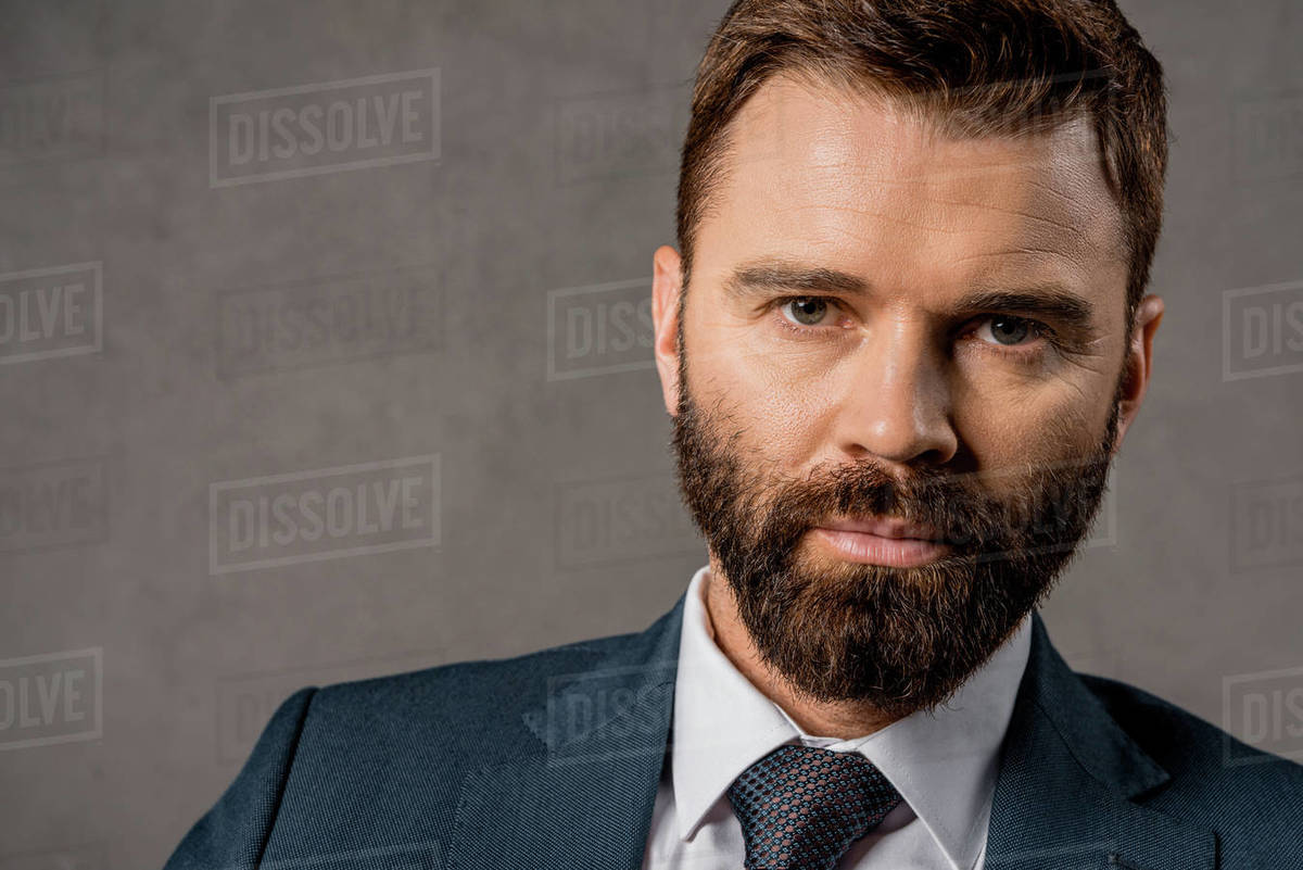 Close up of serious bearded businessman in formalwear - Stock Photo ...