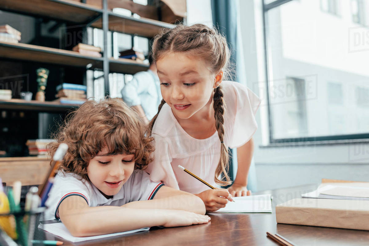 Funny little kids doing homework together - Royalty-free Stock Photo ...