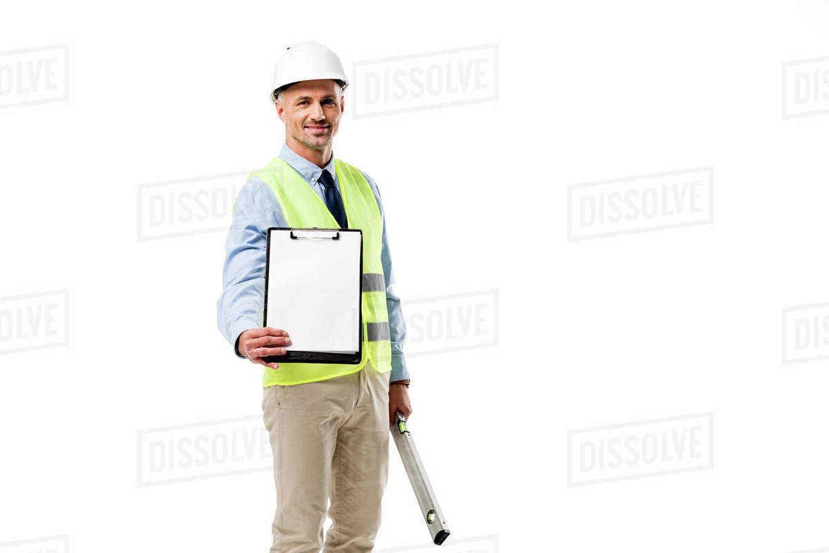 Handsome engineer holding clipboard with blank sheet and spirit level ...