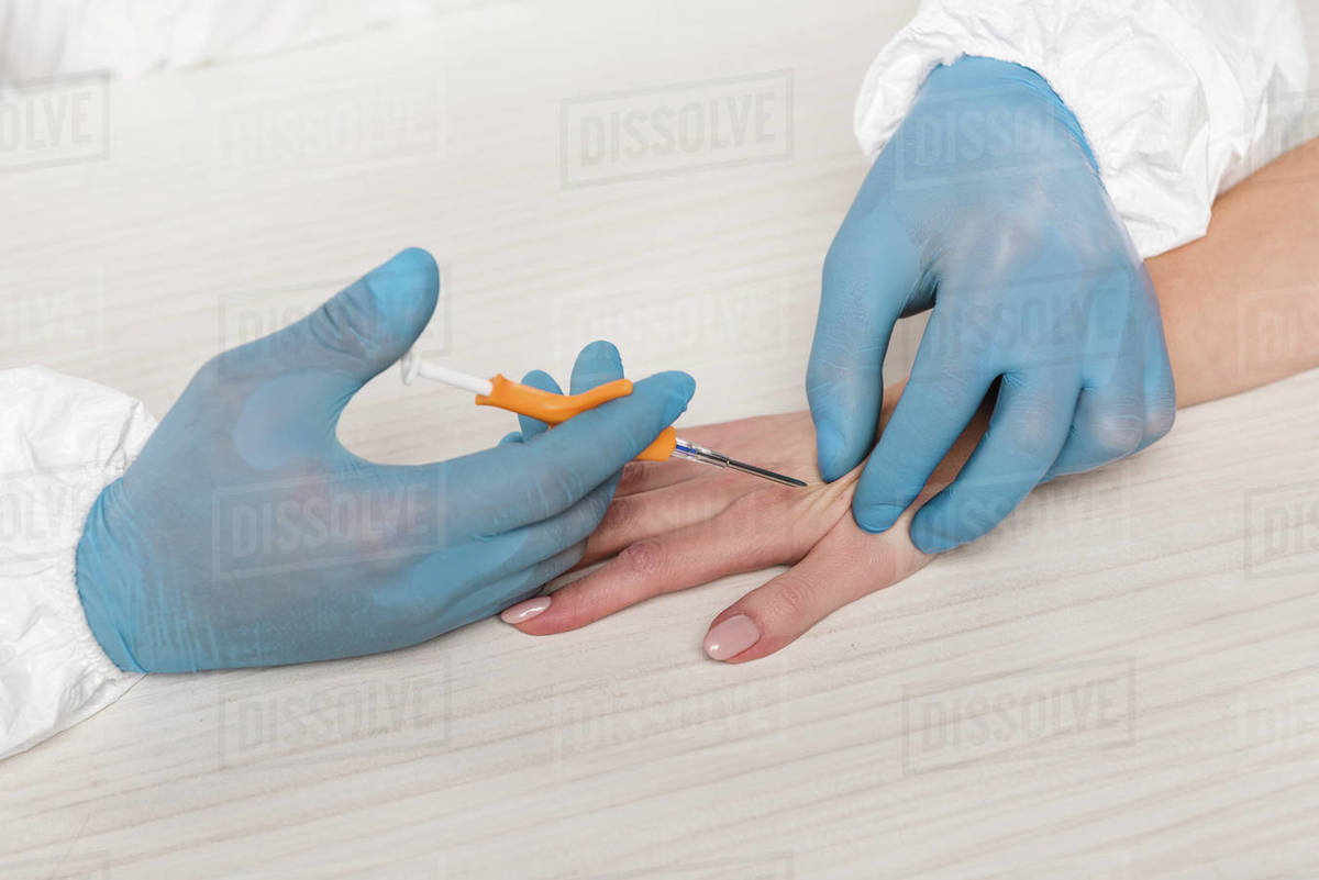 Cropped view of scientist making injection to woman - Royalty-free ...