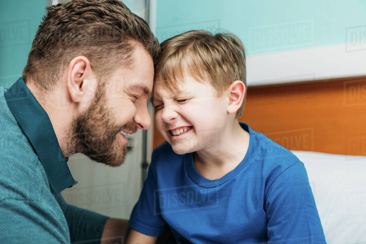 Portrait of smiling dad and son in hospital chamber - Royalty-free ...