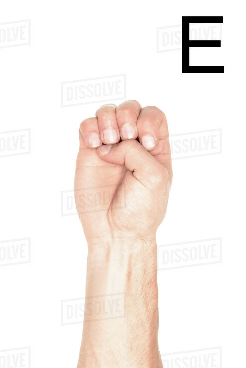 Cropped view of man showing latin letter - E, deaf and dumb language ...